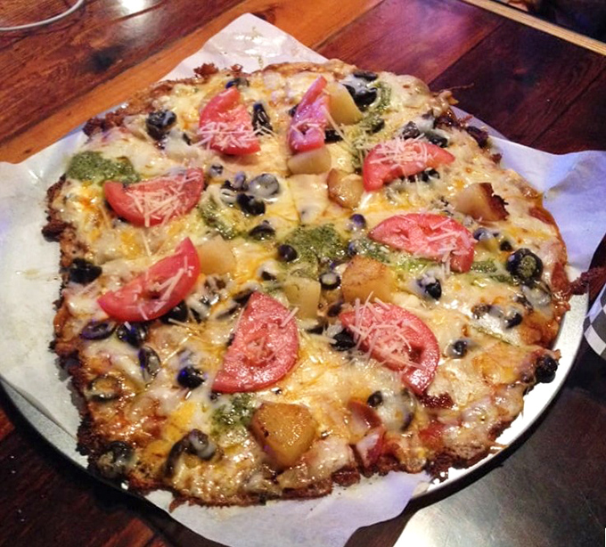 This isn't just pizza&mdash;it's a cheese-crusted revelation topped with fresh tomatoes and olives that somehow makes you feel virtuous while indulging. 