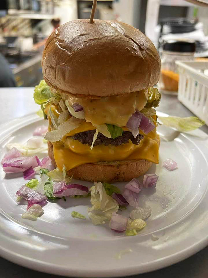 This burger tower requires an engineering degree to eat, but nobody's complaining about structural integrity when it tastes this good.