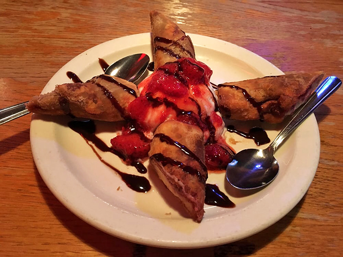Cheesecake bites dressed up fancy with chocolate and berries, because even cowboys need dessert sometimes.