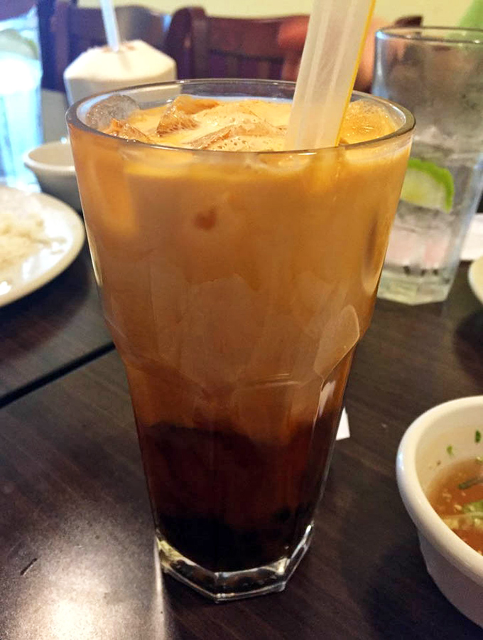 Vietnamese iced coffee with condensed milk – dessert in a glass. The perfect sweet companion to spicy dishes.