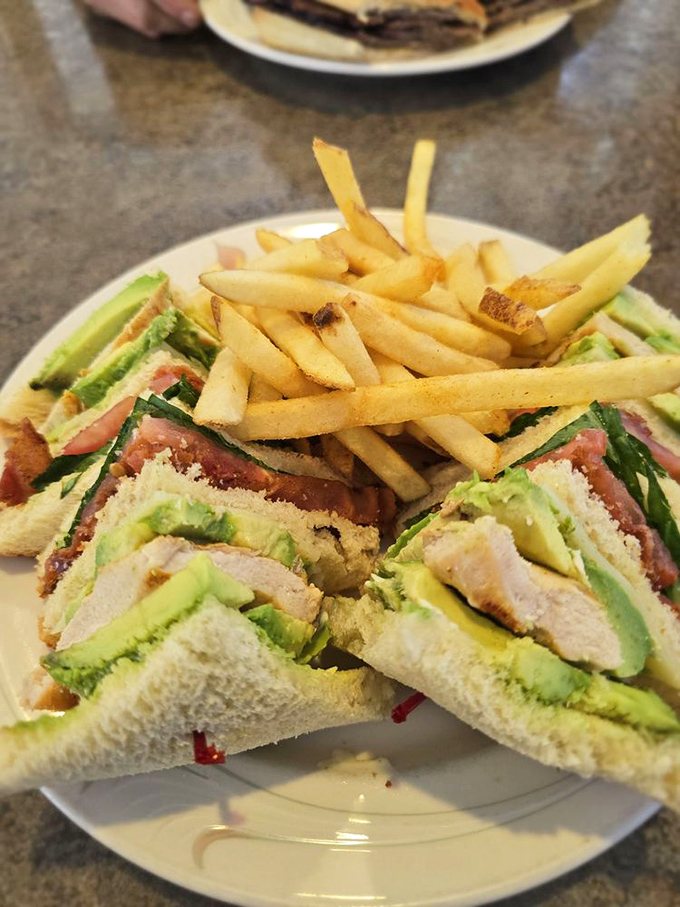 A club sandwich that's actually worth joining! Layers of goodness stacked higher than your weekend reading pile.