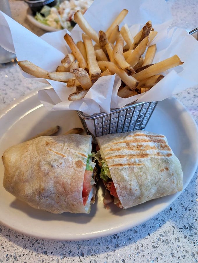 Wrapped perfection served with fries in that little metal basket that somehow makes everything taste 30% better.