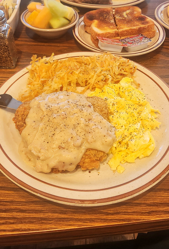 Chicken fried steak smothered in gravy alongside scrambled eggs and hash browns&mdash;the breakfast equivalent of a warm hug from your favorite aunt.