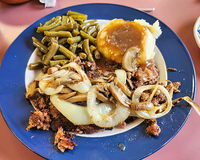 Hamburger steak with sautéed onions – proof that simple ingredients in the right hands can outshine any trendy small plate in a big-city restaurant.
