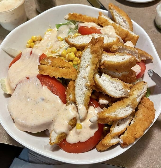 Not just a salad&mdash;a celebration with crispy chicken and creamy dressing. Even the vegetables seem happier here.