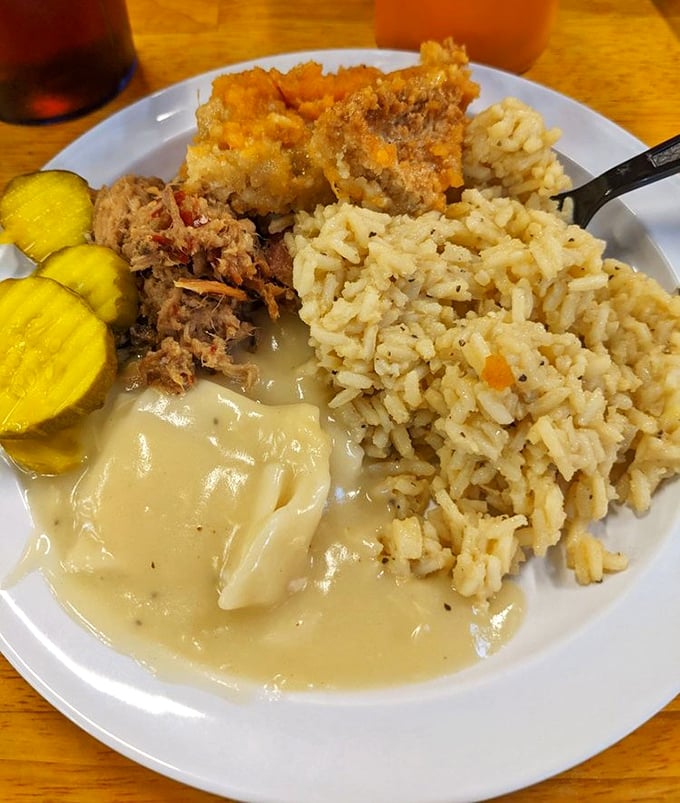 The Southern trifecta: chicken bog, creamy dumplings, and pulled pork with rice&mdash;proof that heaven exists and it's located in Myrtle Beach, South Carolina.
