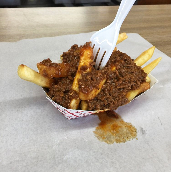 Chili cheese fries that make you forget your table manners&mdash;grab a fork or surrender to using your fingers, no judgment here.