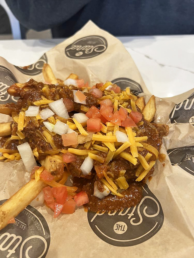 Chili cheese fries that laugh in the face of diet culture&mdash;a glorious mess of comfort that demands to be shared but rarely is.