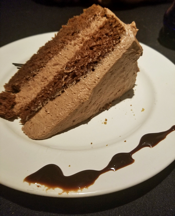 This chocolate cake isn't just dessert; it's therapy on a plate, with layers that promise to solve at least three of your current problems.