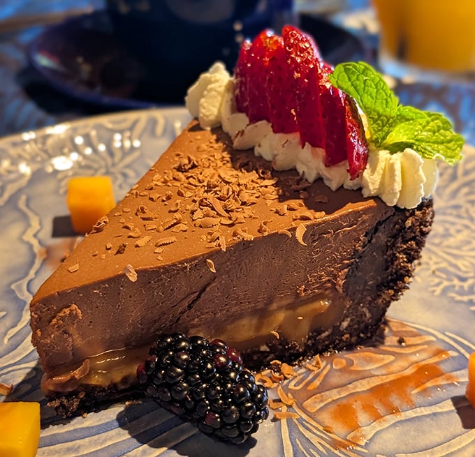 Chocolate meets caramel in a dessert liaison that would make cupid jealous. That blackberry isn't garnish &ndash; it's the perfect tart counterpoint to sweet decadence.