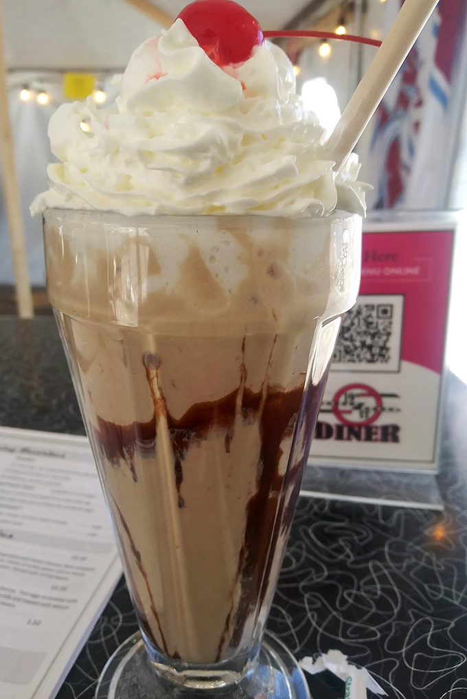 Chocolate malt topped with whipped cream and a cherry&mdash;the kind of nostalgic indulgence that makes adults remember why being a kid was awesome.