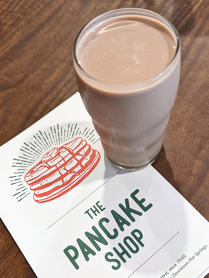 Chocolate milk served in a proper glass because some traditions are worth keeping, no matter your age or decade.