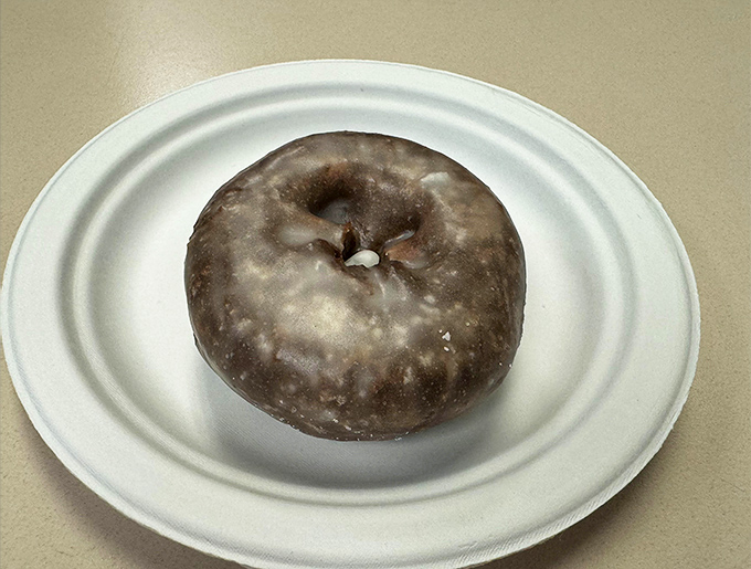 That chocolate glaze looks like a mirror you could check your reflection in—right before destroying it with the perfect first bite.