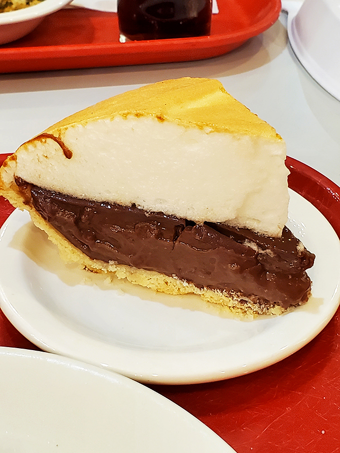 This chocolate cream pie stands tall and proud, like it knows it's about to make your day.