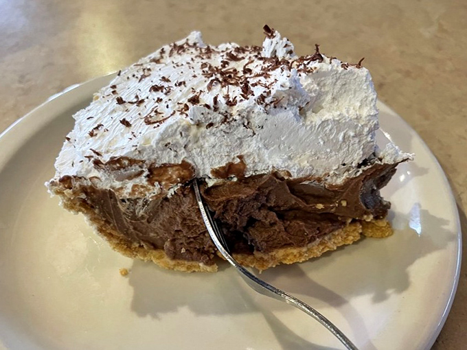 Chocolate cream pie with a mountain of whipped topping that would make Marie Antoinette say, "Forget cake!" A slice of heaven that's worth every calorie.