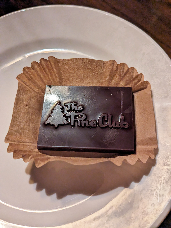 The Pine Club's chocolate finale &ndash; because after conquering a steak dinner, you deserve a sweet victory lap emblazoned with their logo.