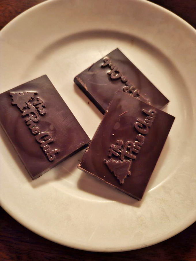 Chocolate squares embossed with The Pine Club logo—the edible equivalent of a mic drop at the end of your meal.