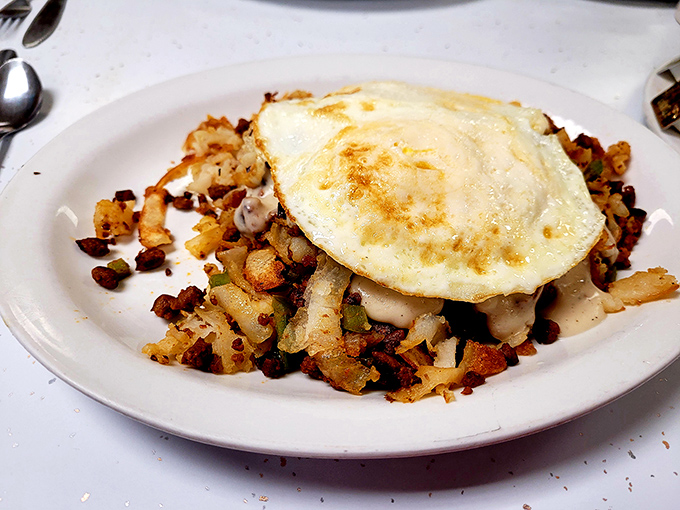 This chorizo hash delivers a perfect symphony of crispy potatoes, seasoned meat, and runny egg magic.