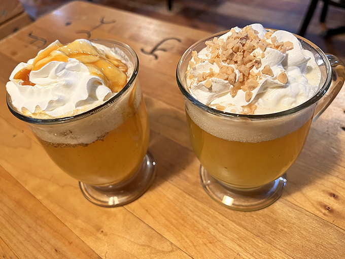 Hot apple cider topped with whipped cream and caramel&mdash;liquid autumn in a glass that warms you from the inside like a flannel shirt for your soul.