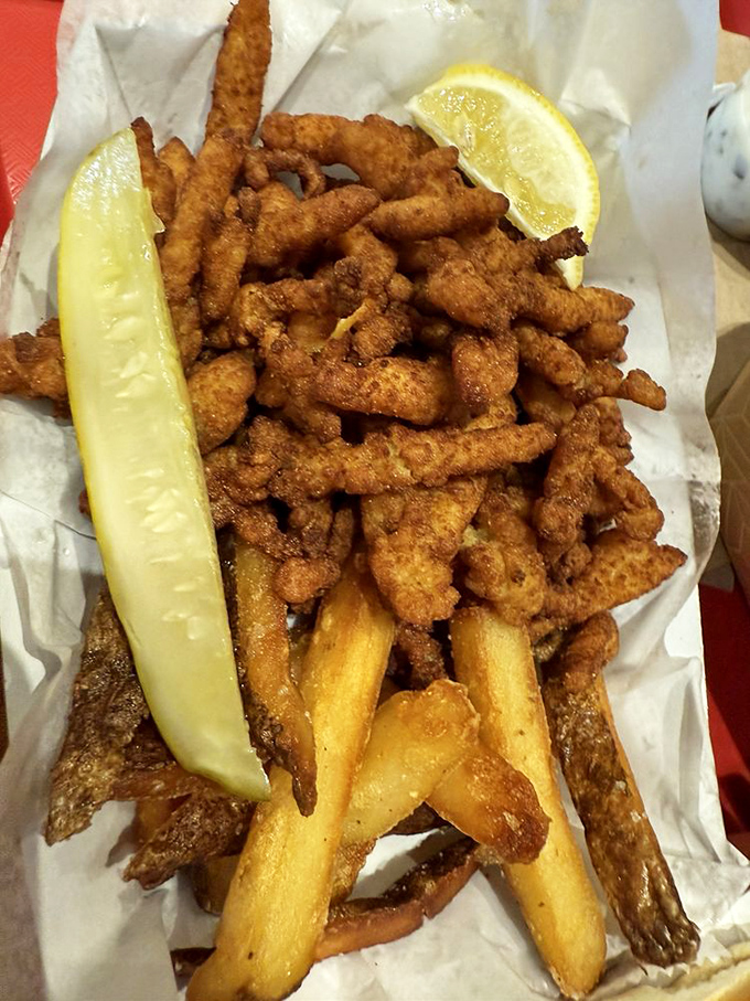 Crispy fried clam strips and fries&mdash;the beach vacation you can eat. That lemon wedge stands ready to brighten each perfectly golden bite.