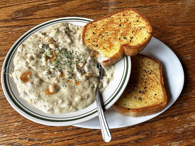 Clam chowder so hearty it could qualify as a main course, paired with garlic toast that's ready to dive in for the ultimate comfort food experience.