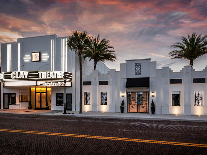 The Clay Theatre's Art Deco splendor lights up downtown at dusk, offering entertainment without requiring a second mortgage for tickets.