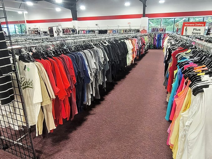 Clothing racks stretch endlessly like a fashion time machine set to "all decades simultaneously."