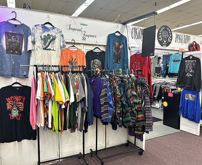 A kaleidoscope of t-shirts hanging like colorful flags, each one representing the republic of personal expression and affordable style.