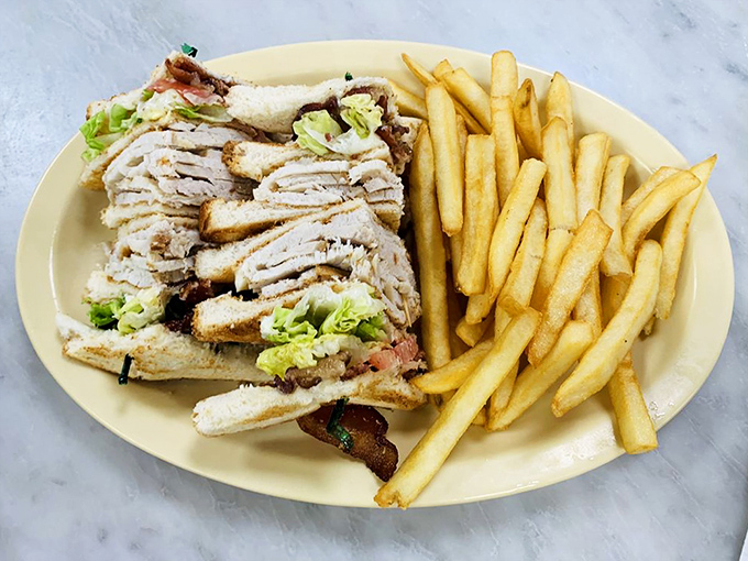 The club sandwich: three layers of bread playing referee between turkey, bacon, and veggies in the most delicious game of stack-'em-up ever played.