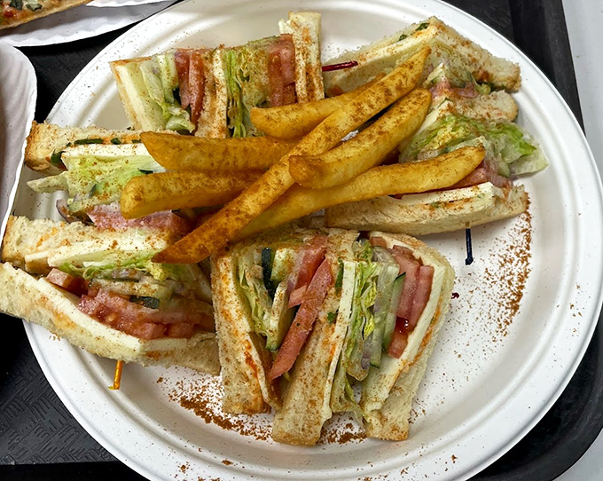 The club sandwich &ndash; architecture you can eat. Those masala-dusted fries on the side aren't just a garnish, they're a revelation.