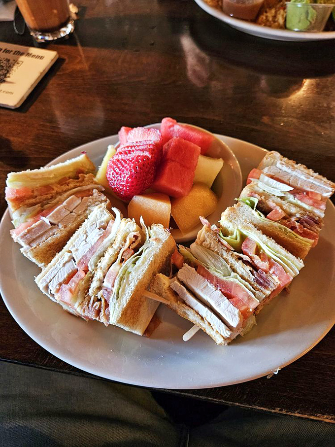 That club sandwich comes with enough fresh fruit to make you feel virtuous about your lunch choices.