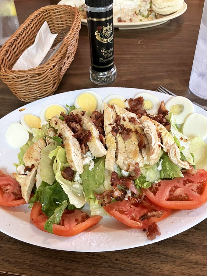 This Cobb salad isn't just arranged, it's choreographed – a protein-packed dance of chicken, eggs, and vegetables that makes healthy eating feel indulgent.