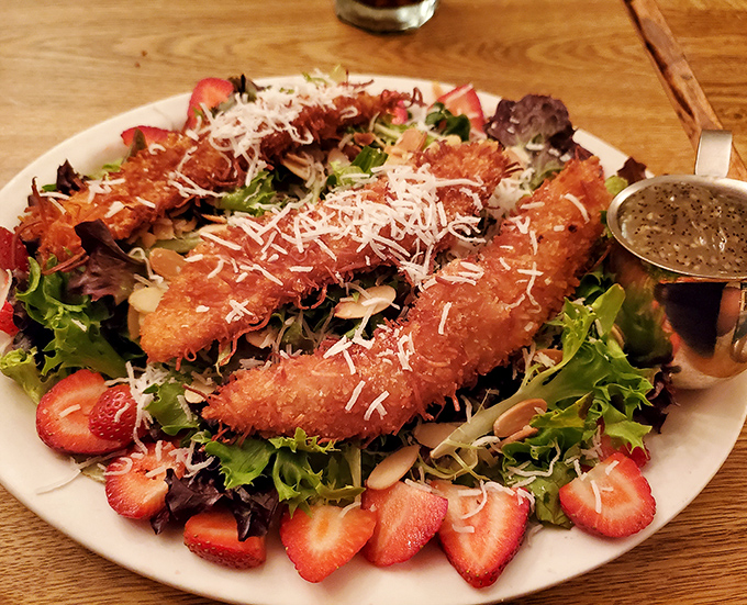 A salad that makes you forget you came for steak! Crispy coconut chicken, fresh strawberries, and mixed greens create a carnival of flavors.