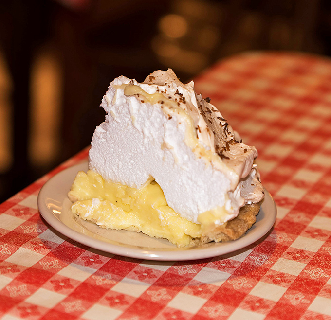 Coconut cream pie with a mile-high meringue that defies both gravity and restraint. One bite and you'll be planning your next visit.