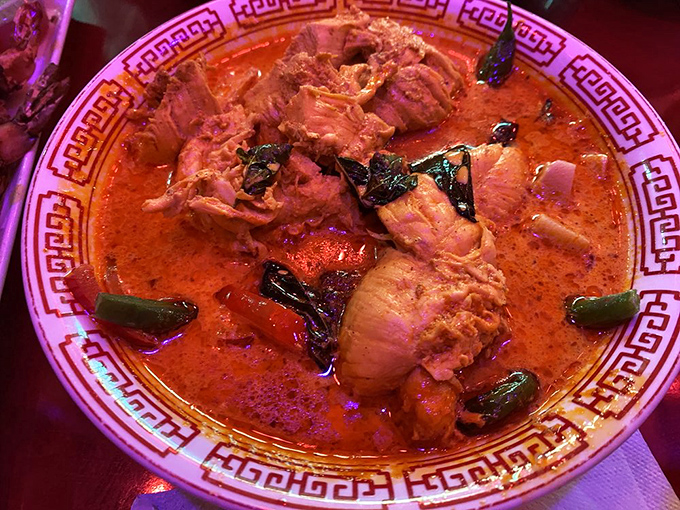 The coconut curry arrives like a sunset in a bowl, its vibrant colors promising a warmth that Oregon winters desperately need.