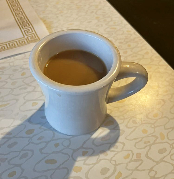 This isn't artisanal pour-over coffee in a hand-thrown ceramic vessel. It's honest diner coffee in a sturdy mug that's seen things. And it's perfect.