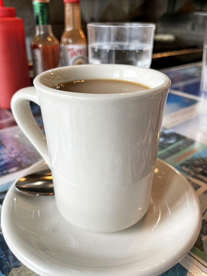 Simple pleasures in white ceramic. This isn't fancy third-wave coffee with tasting notes&mdash;it's the honest cup that keeps conversation and breakfast flowing.