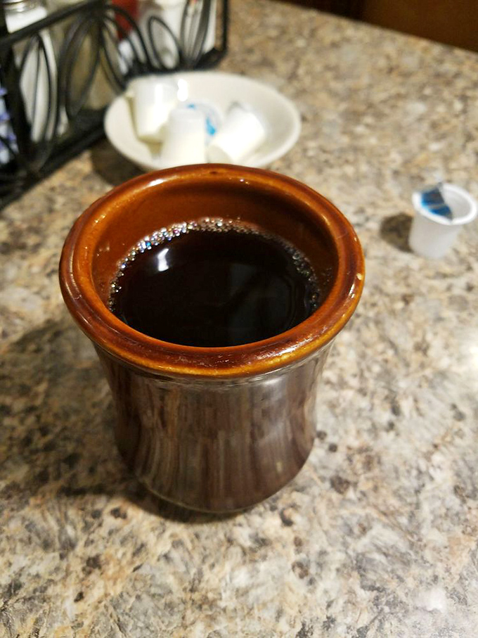 The coffee comes in these sturdy brown mugs that say, "I'm serious about caffeine and I don't need fancy porcelain to prove it."