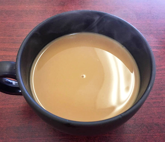 A simple cup of coffee that reminds us some pleasures need no embellishment &ndash; just a steady hand pouring and a moment to appreciate life's pause button.