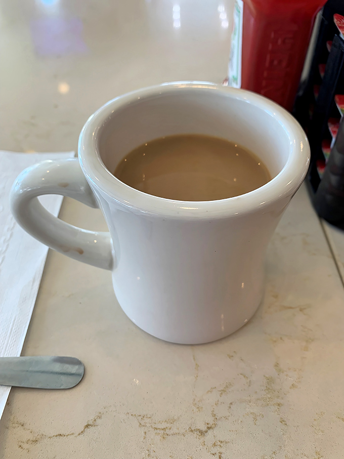 The humble diner coffee mug&mdash;unassuming vessel of morning salvation. No fancy latte art needed when the caffeine delivery system is this perfectly straightforward.
