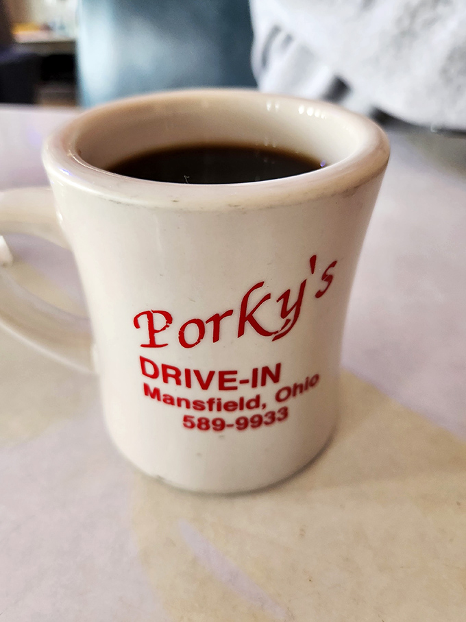 Even the coffee mug proudly displays its heritage, serving up liquid motivation alongside those legendary patty melts.