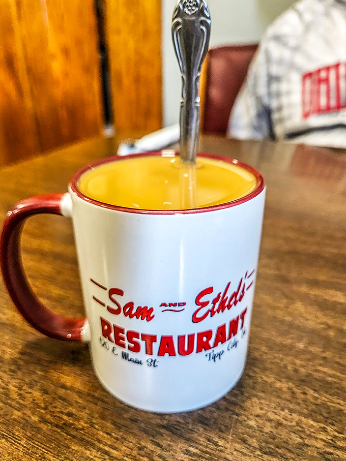 That signature mug isn't just holding coffee &ndash; it's cradling liquid motivation in a vessel that's become as iconic as the restaurant itself.