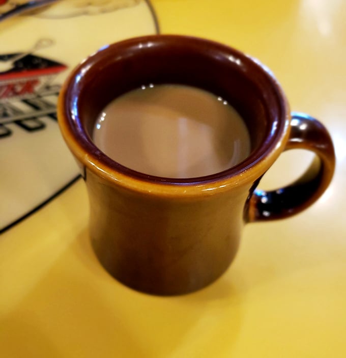 That sturdy mug isn't just holding coffee&mdash;it's cradling liquid motivation in a vessel that's survived decades of refills and revelations. Diner coffee: the original energy drink.