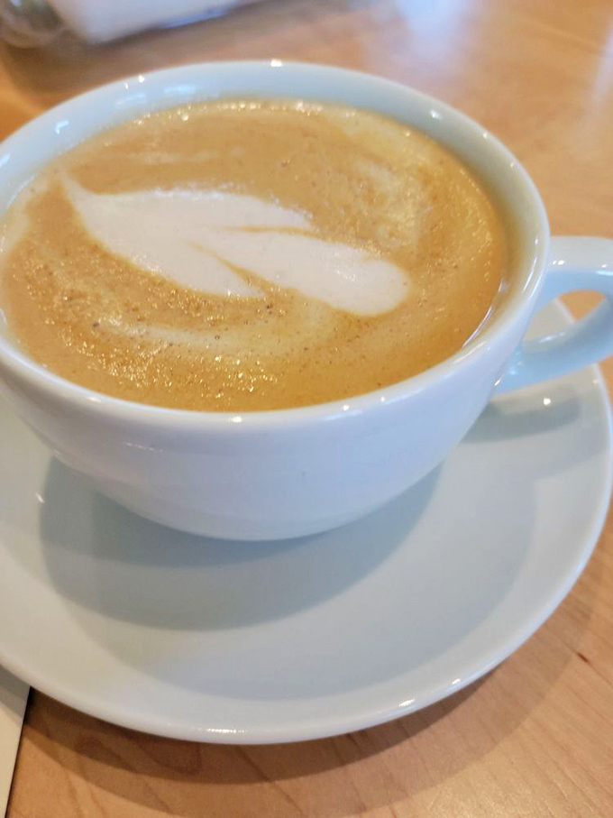 Coffee art that's almost too pretty to drink. Almost. The partnership with local Sump Coffee elevates the morning caffeine ritual to new heights.