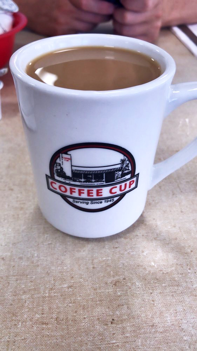 The coffee mug tells a story of tradition while the liquid inside tells a story of why you'll be fully awake for the next six hours.