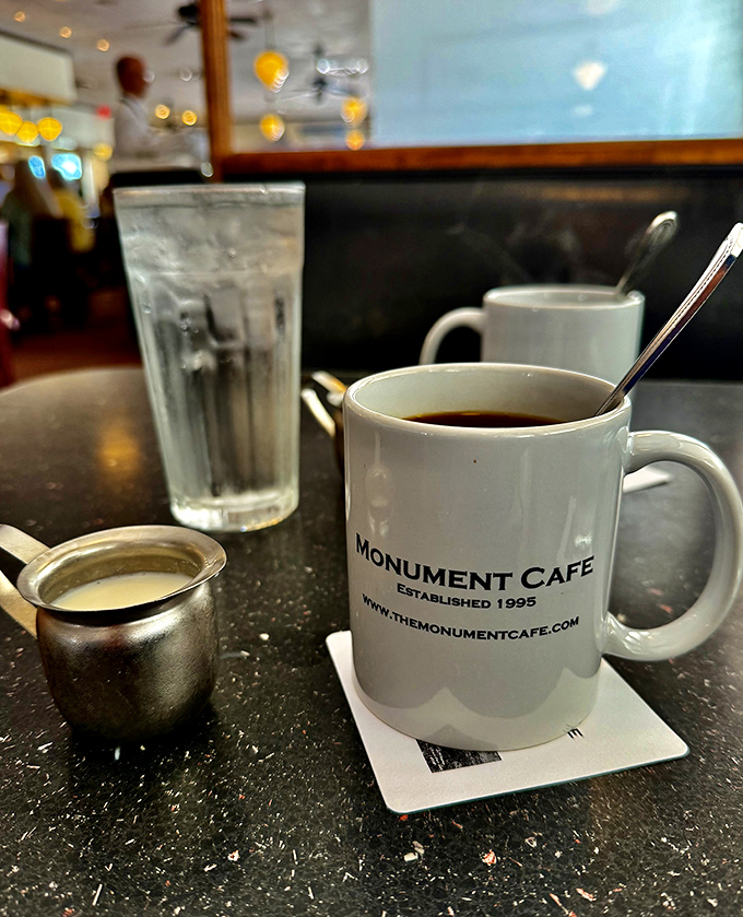 That classic white mug isn't just holding coffee&mdash;it's cradling liquid motivation that's been fueling Georgetown conversations since 1995.