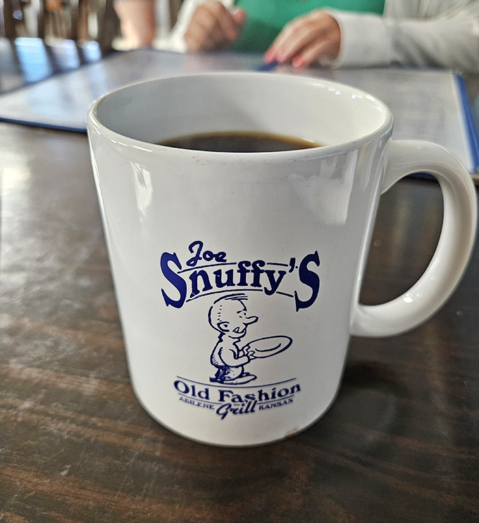 The coffee mug says it all—"Old Fashion Grill" where the java flows freely and conversation follows naturally.