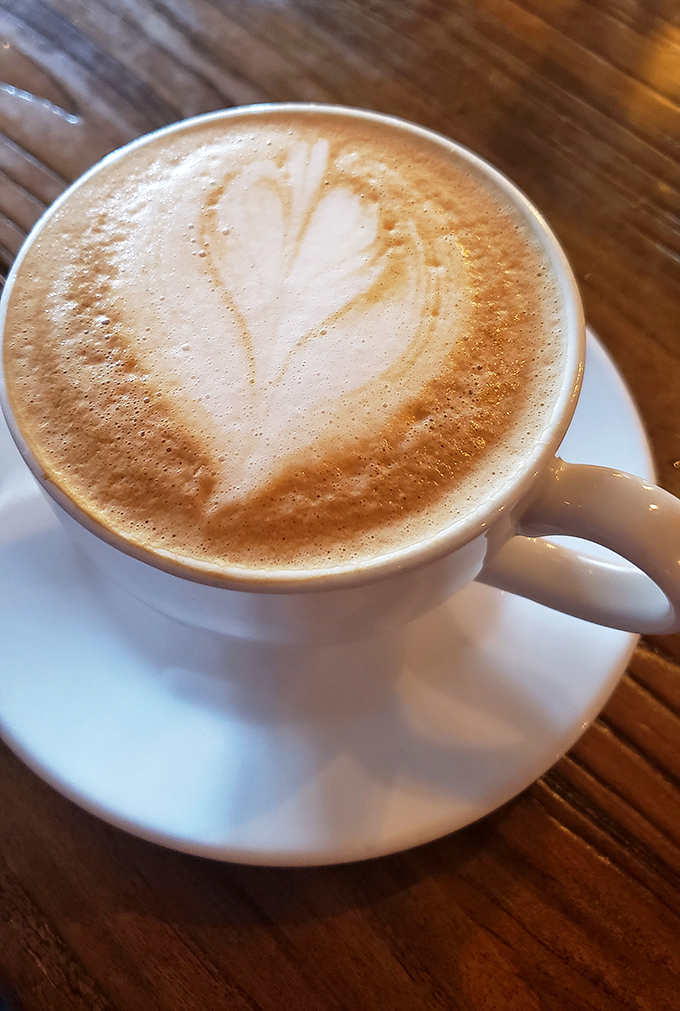 Coffee art that's almost too pretty to drink. Almost. This heart-topped latte promises the perfect balance of comfort and caffeination.