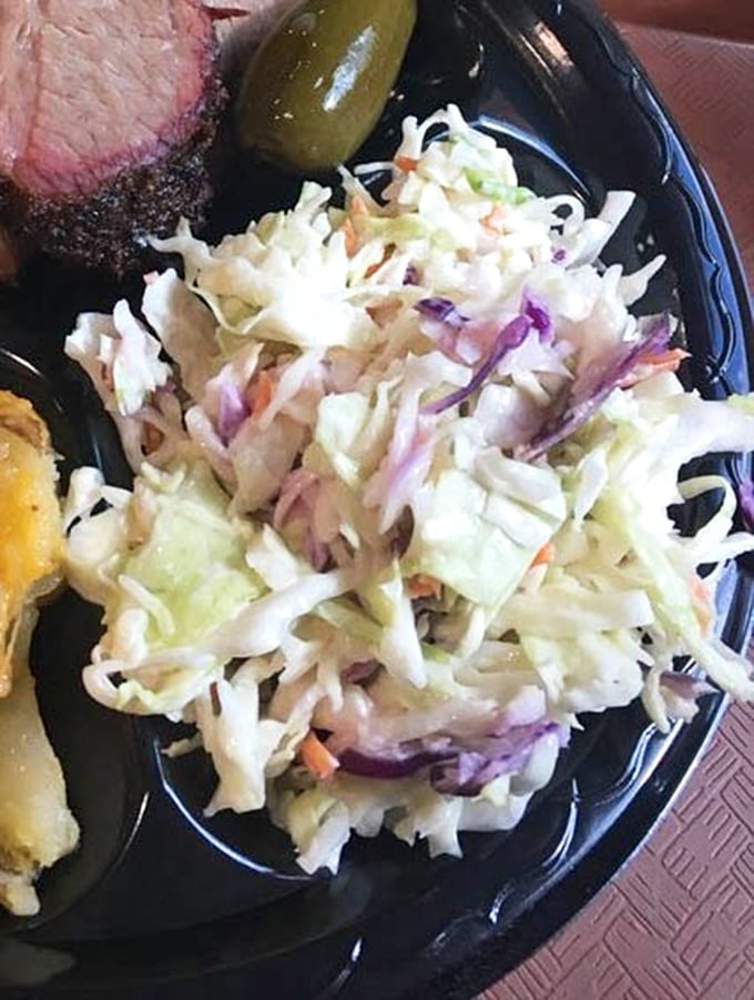 Coleslaw that knows its role – not the star, but the essential supporting actor that cuts through the richness of smoked meat with crisp, cool contrast.