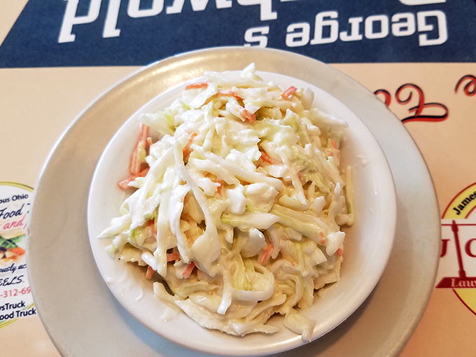 Coleslaw so fresh and creamy it deserves its own fan club. The perfect cool counterpoint to the diner's heartier offerings.